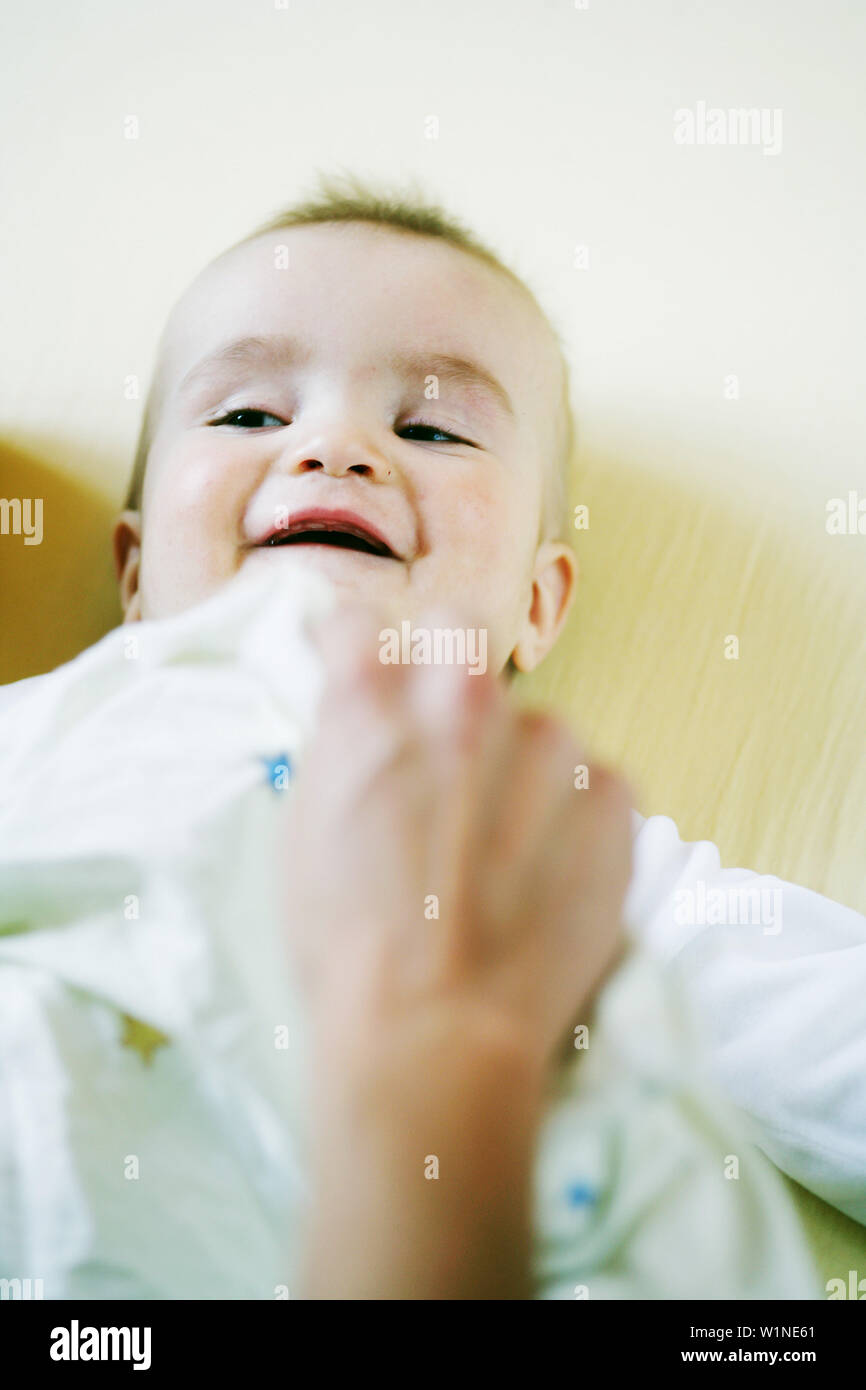 Baby being wrapped in a blanket Stock Photo - Alamy