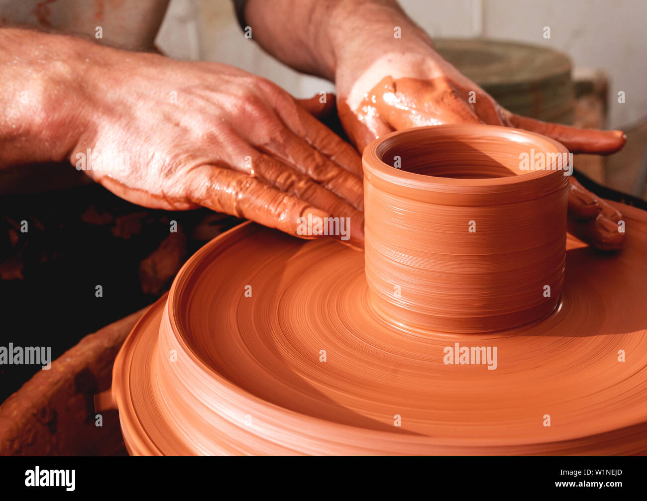 Professional potter making bowl in pottery workshop, studio Stock Photo ...
