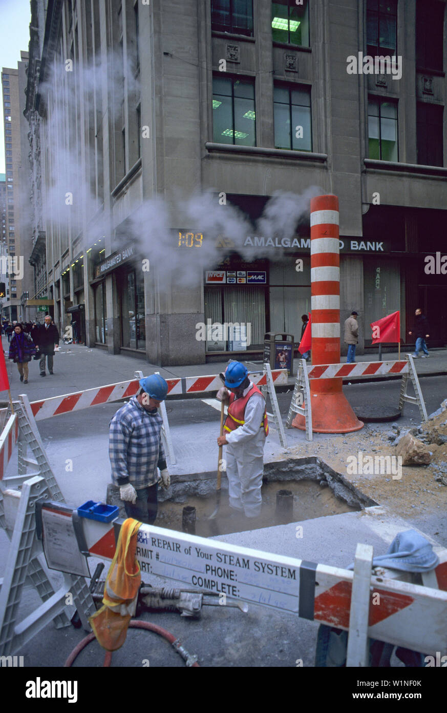 Diverting steam on a Manhattan street. The underground steam network is ...