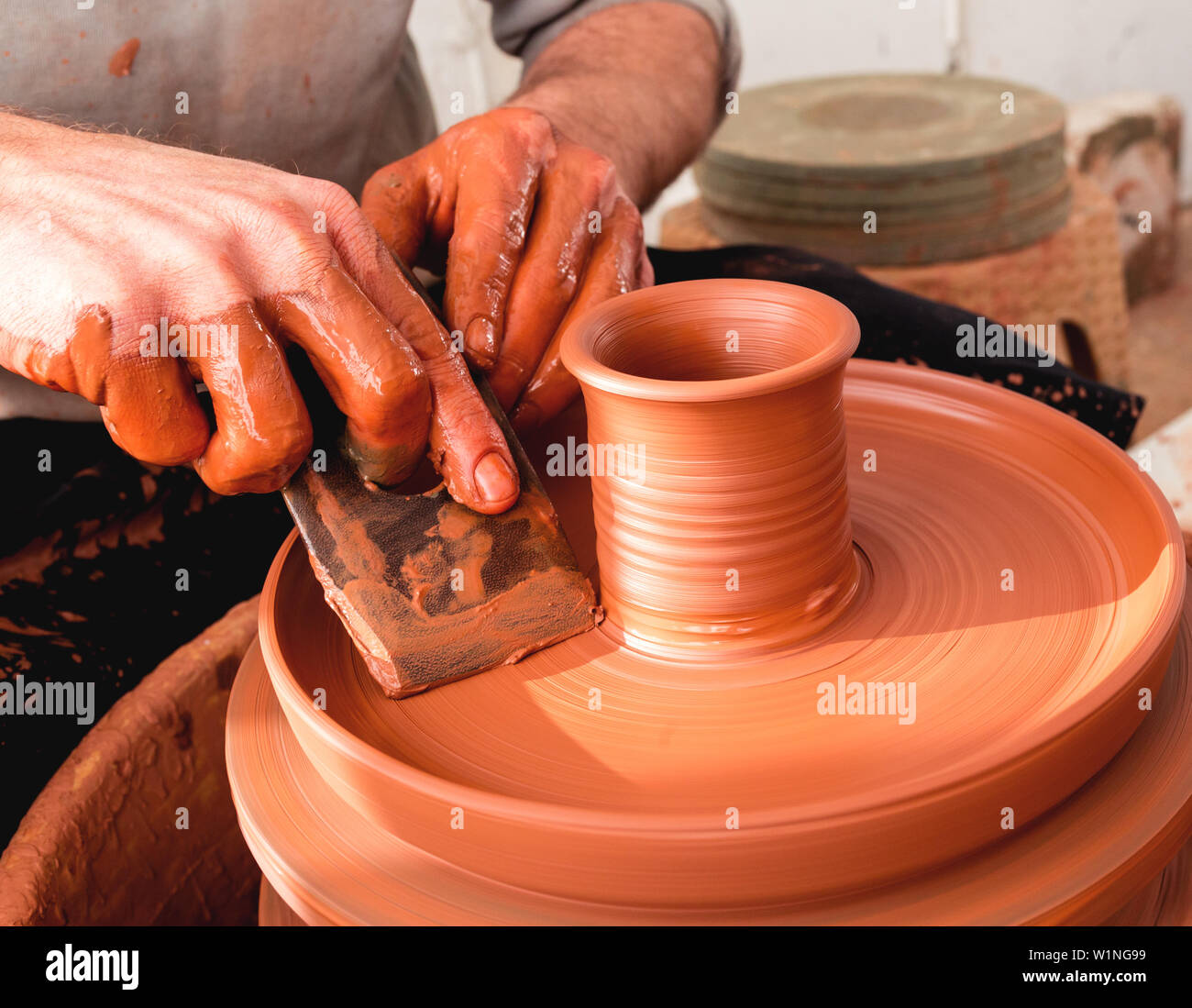 Professional potter making bowl in pottery workshop, studio Stock Photo ...