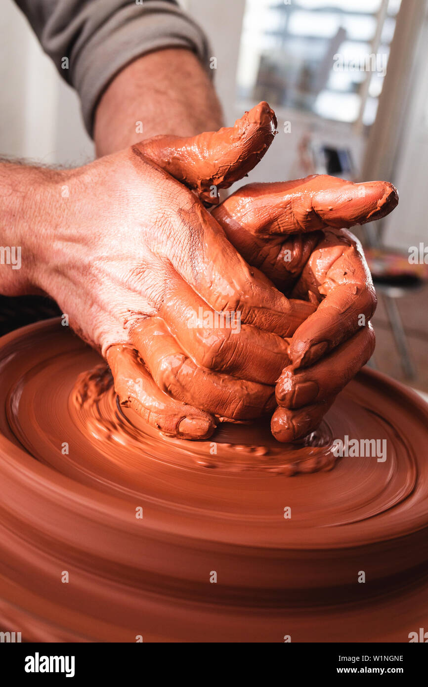 Professional potter making bowl in pottery workshop, studio Stock Photo ...