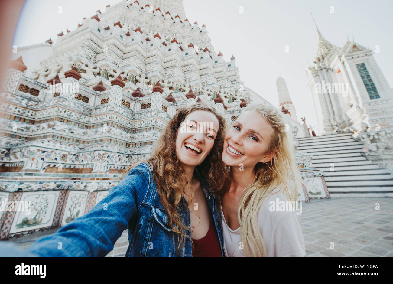Couple of beautiful girls visiting bangkok maining attractions Stock ...