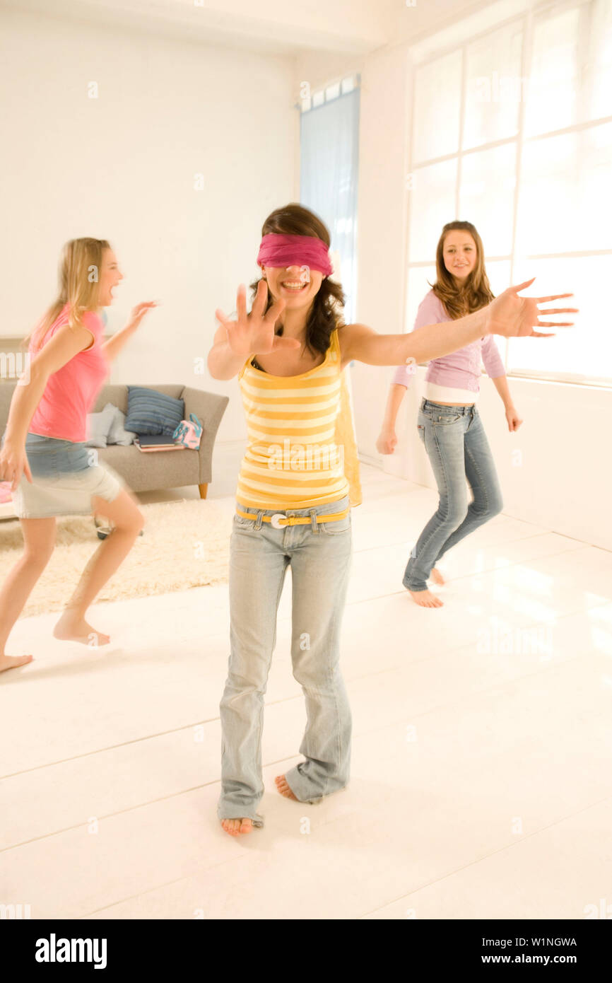 Teenage girls (14-16) playing Blind Man's Bluff Stock Photo - Alamy
