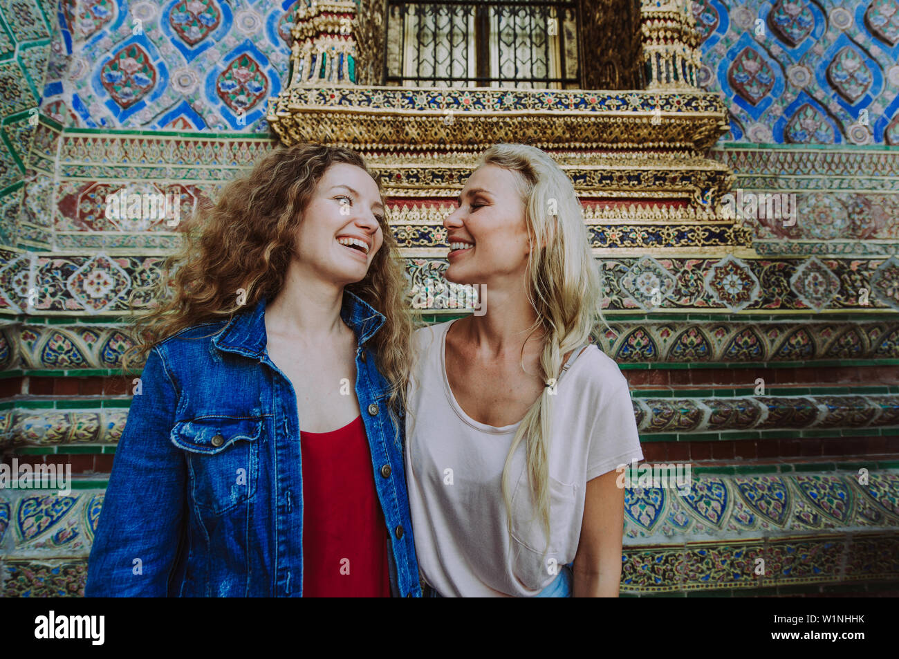 Couple of beautiful girls visiting bangkok maining attractions Stock ...