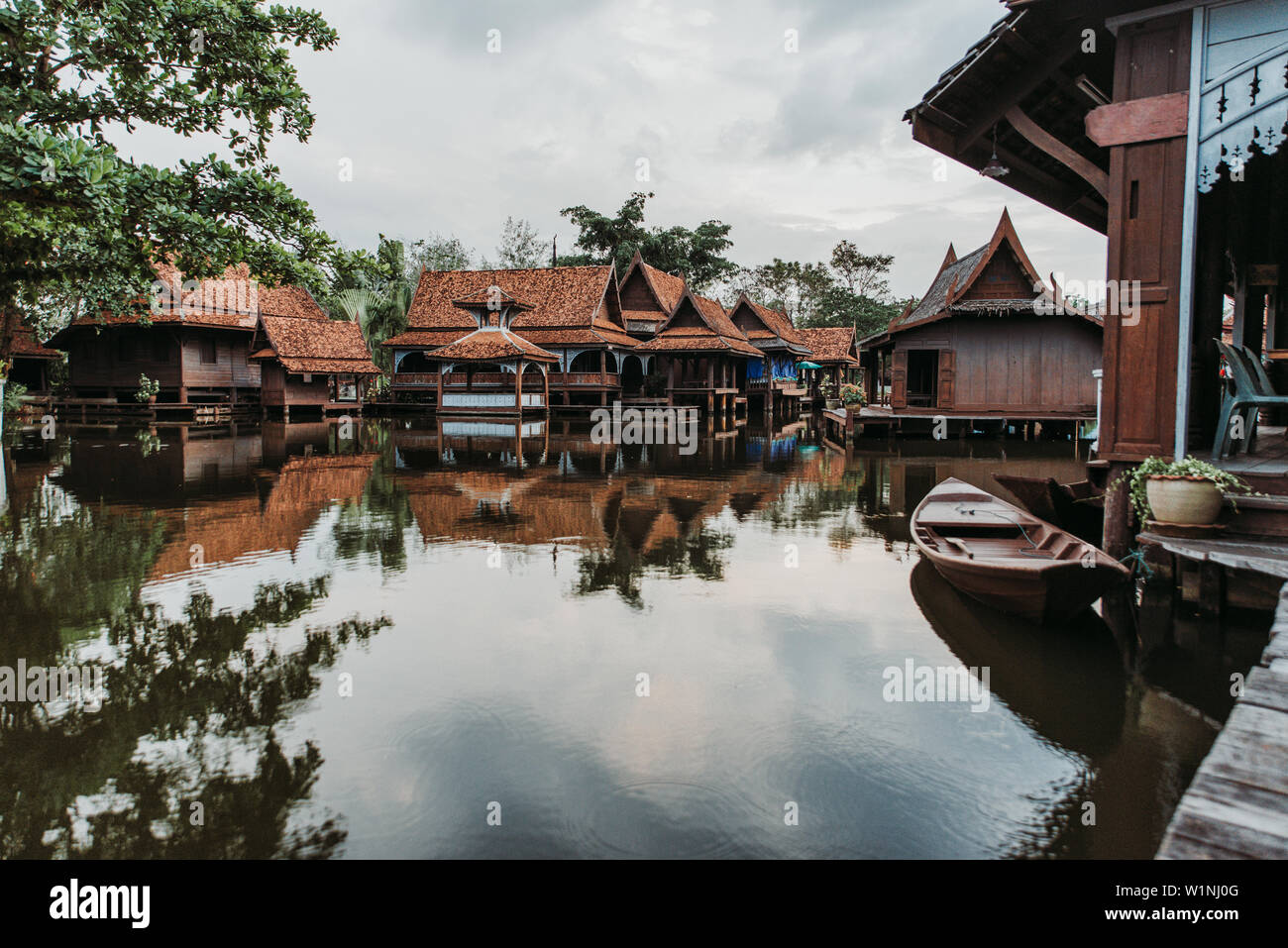 Asian floating market, and typical village on the water Stock Photo - Alamy