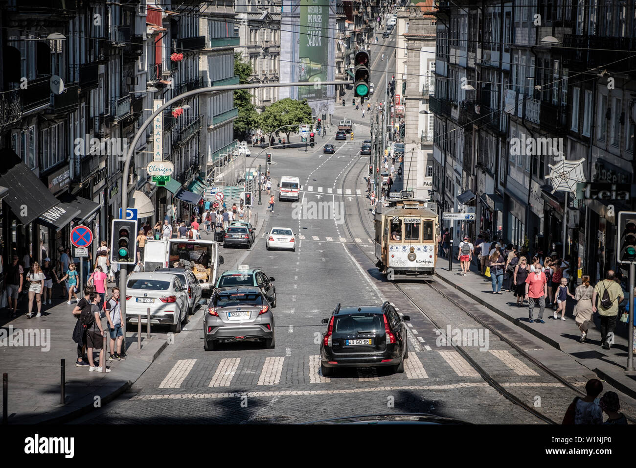 People walking in the beautiful and typical streets of Porto on a ...