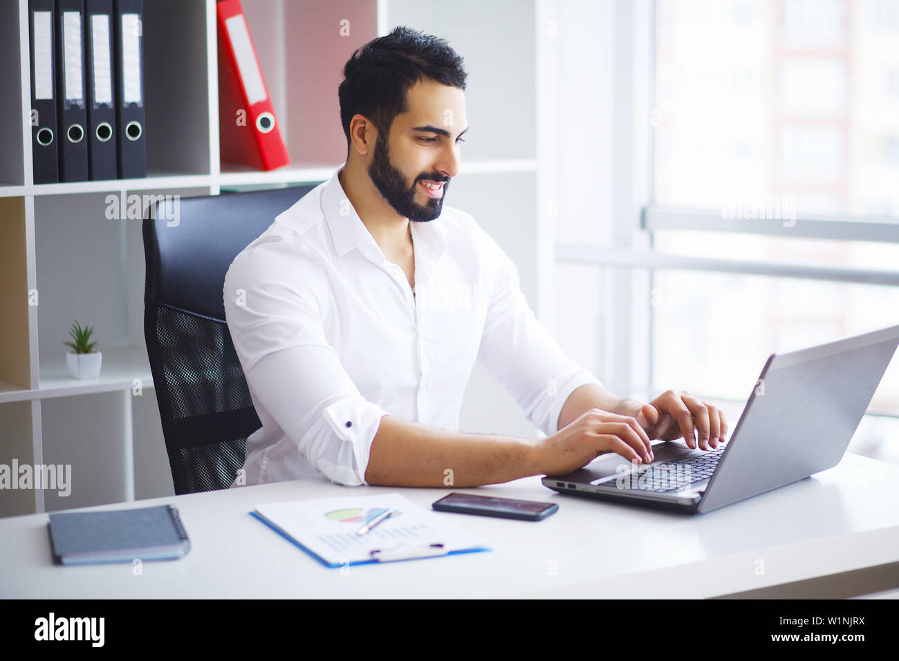 Man Working At Computer In Contemporary Office Stock Photo - Alamy