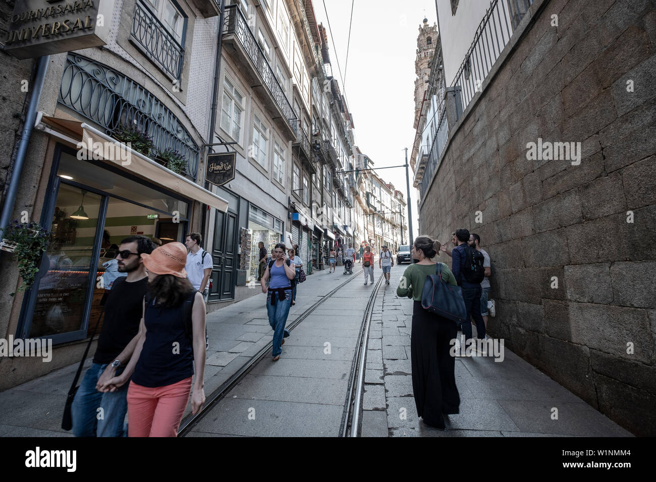 People walking in the beautiful and typical streets of Porto on a ...