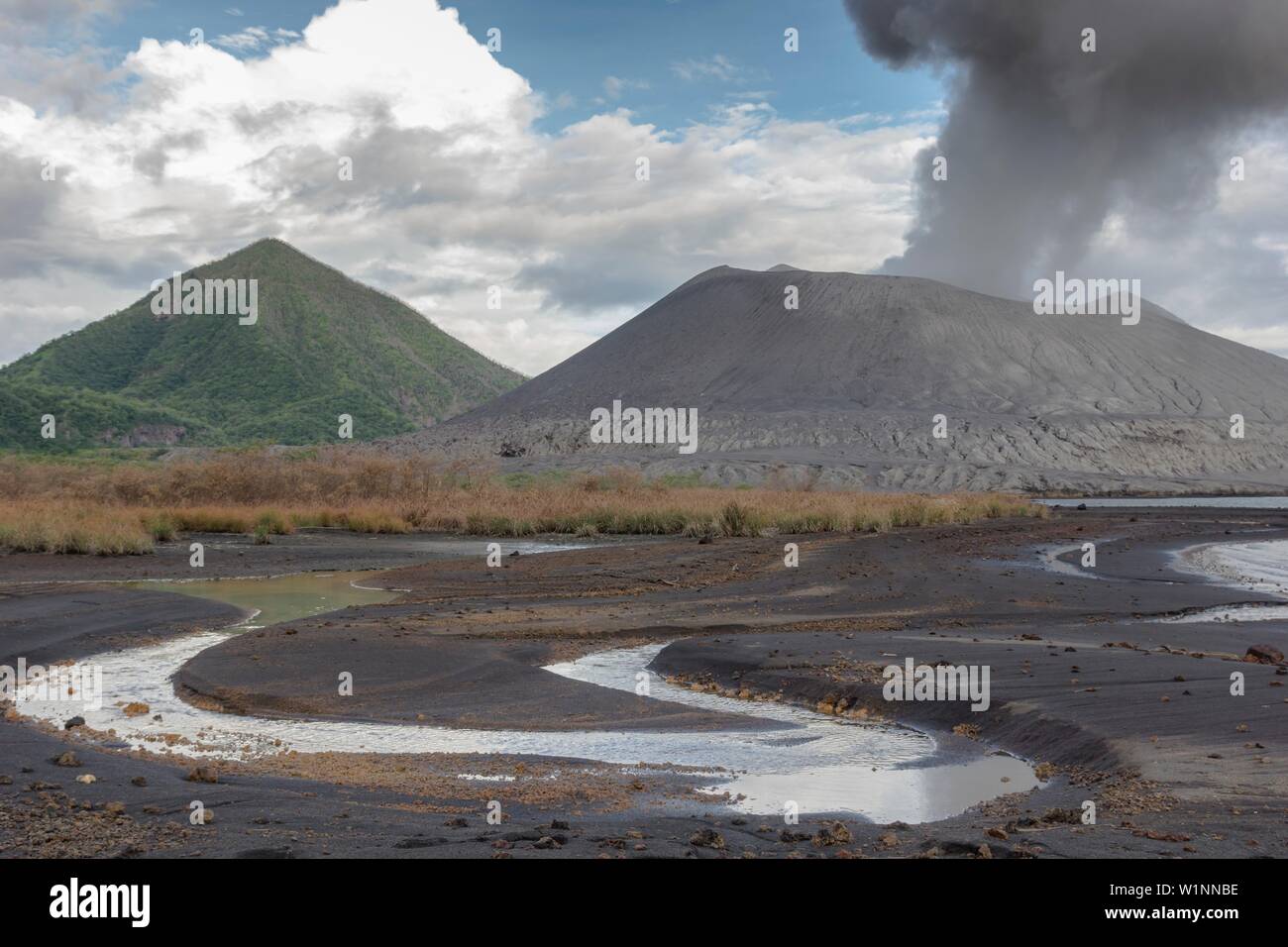 Eruption of the active volcano Tavurvur with ash cloud. In the ...