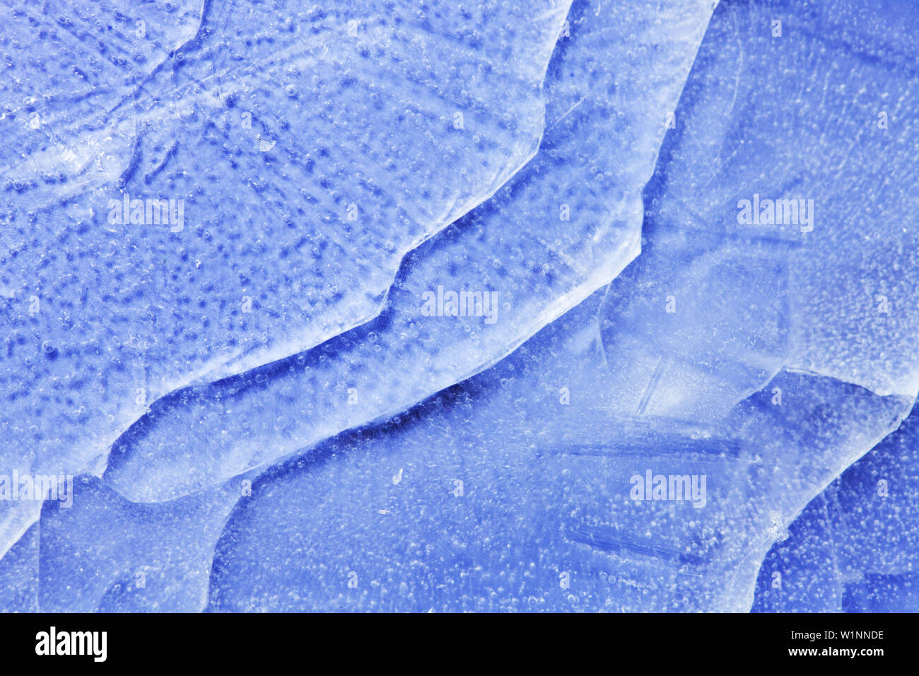 blue cracked ice. texture of frozen water Stock Photo - Alamy