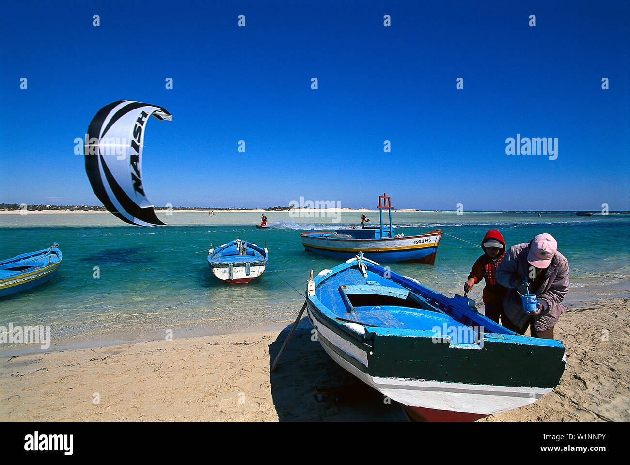 Kitesurfer & Fishing boats, Djerba Tunesia Stock Photo - Alamy