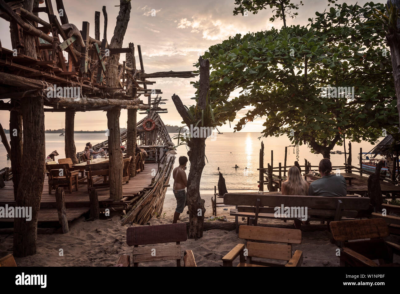 sunset at the so called Hippie Bar in the shape of a pirate ship in ...