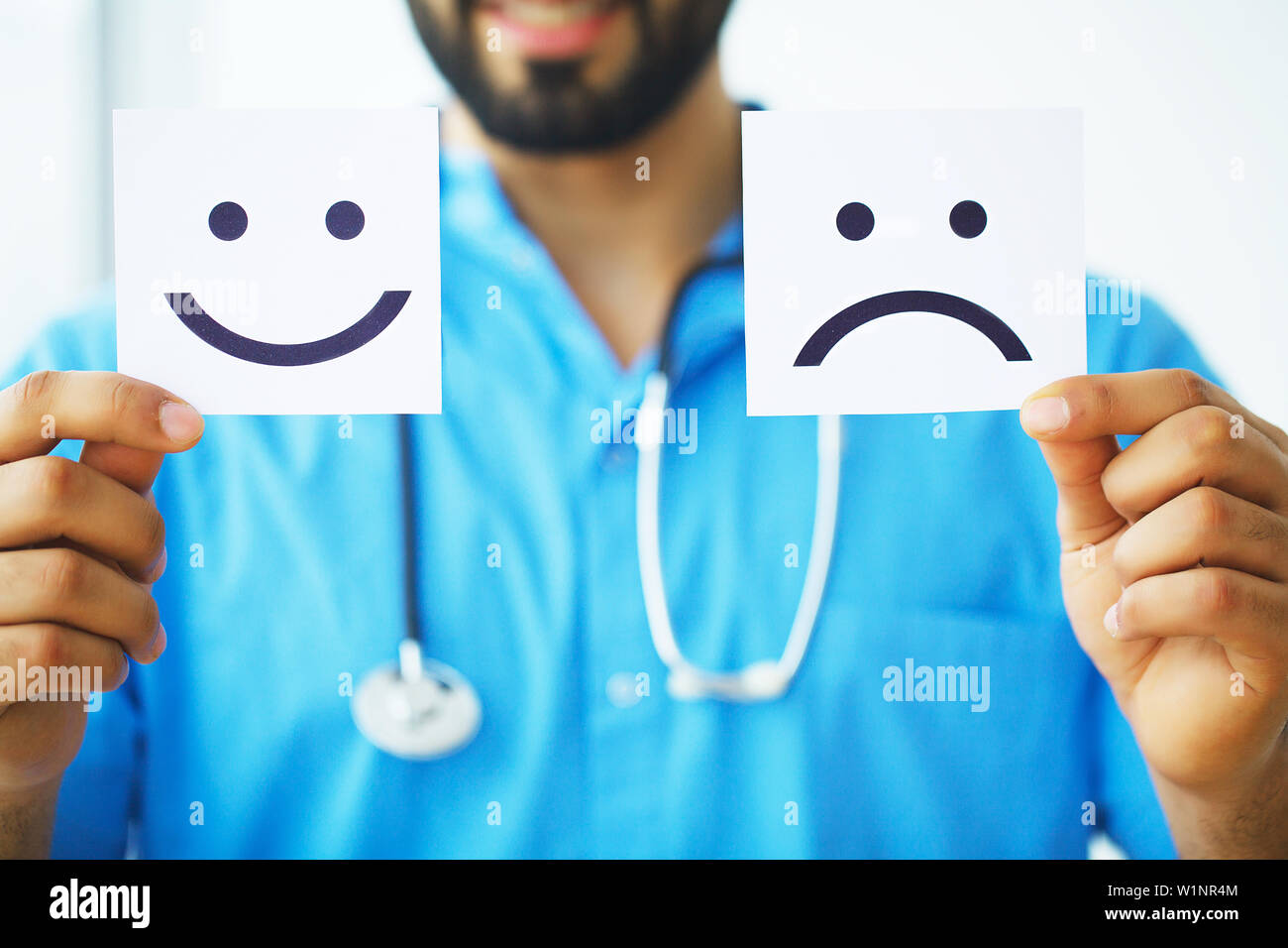 Doctor holding a card with symbol Help, Medical concept Stock Photo - Alamy