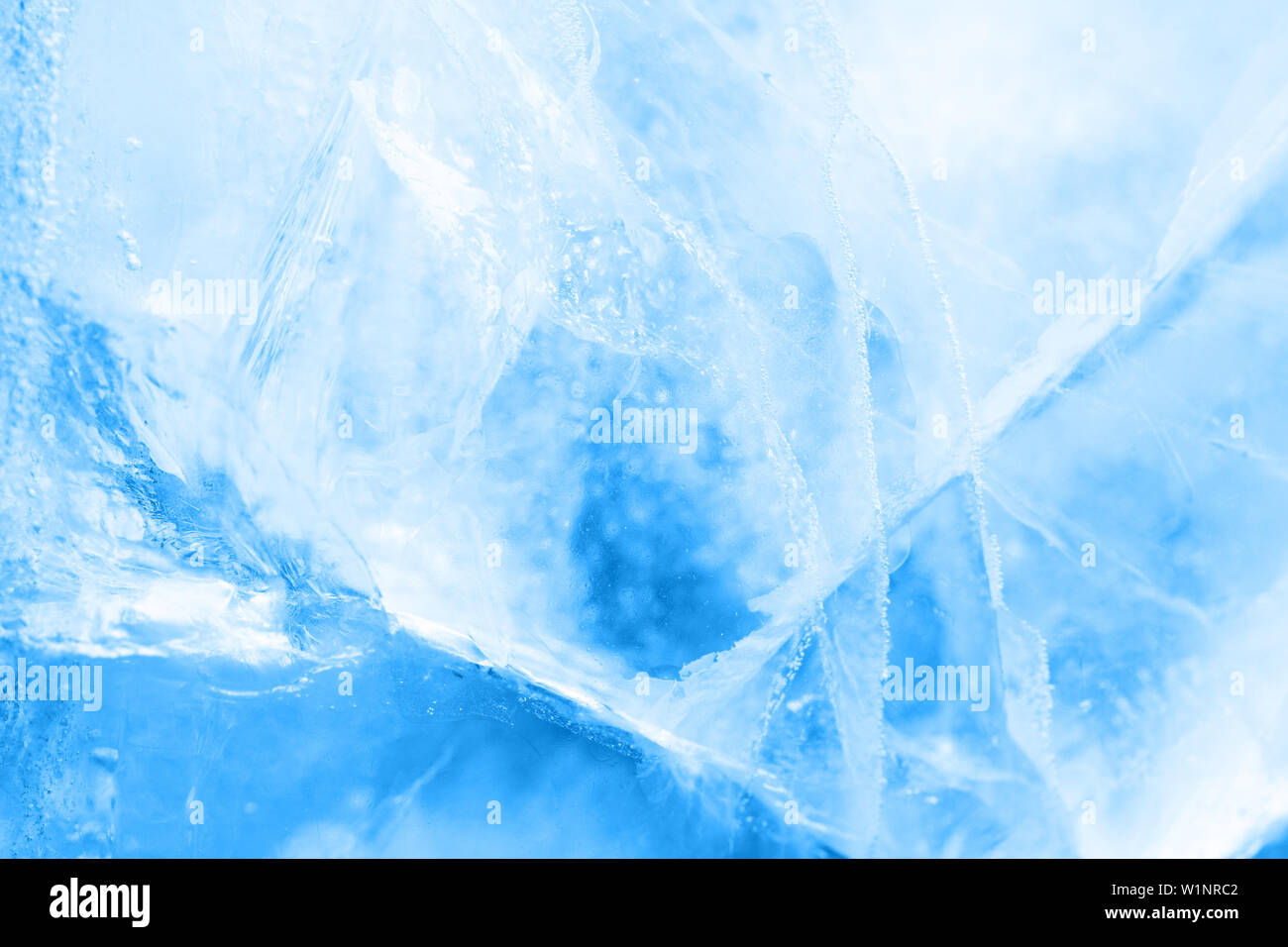 blue cracked ice. texture of frozen water Stock Photo - Alamy