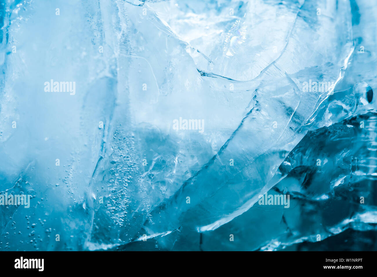 blue cracked ice. texture of frozen water Stock Photo - Alamy