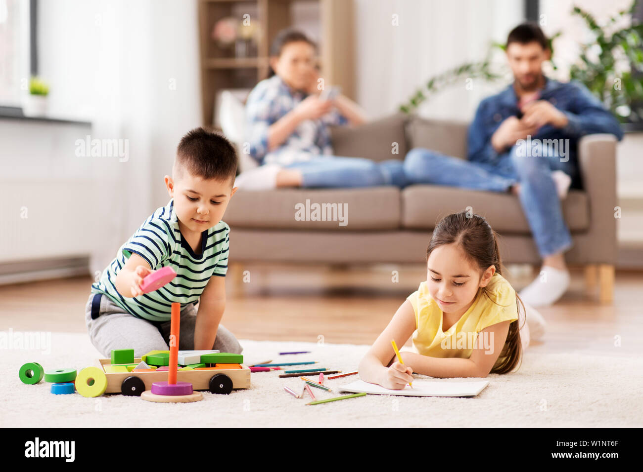 brother and sister playing and drawing at home Stock Photo - Alamy