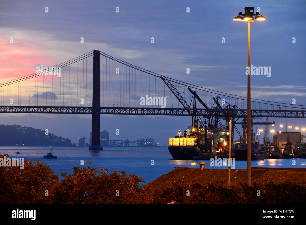 Bridge of 25th of April with harbour, Lisbon, Portugal Stock Photo - Alamy