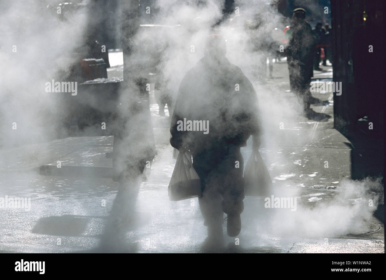 Diverting steam on a Manhattan street. The underground steam network is ...