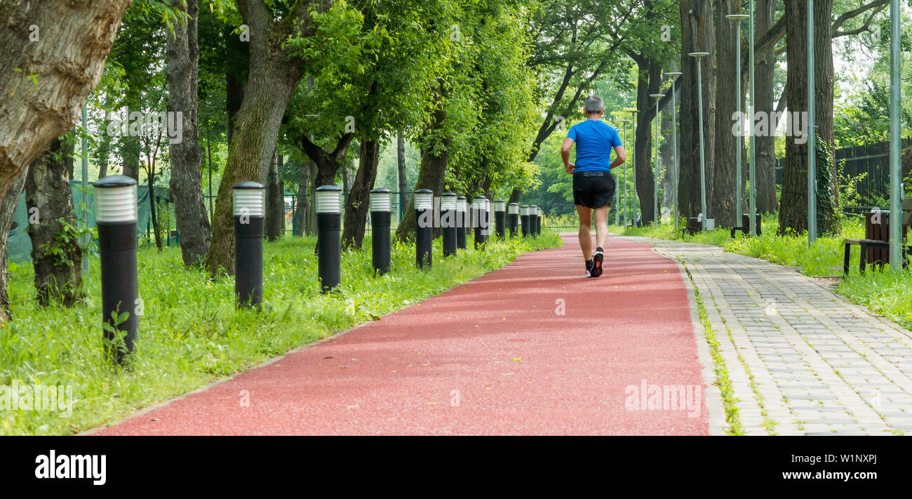 Senior runner running in path hi-res stock photography and images - Alamy