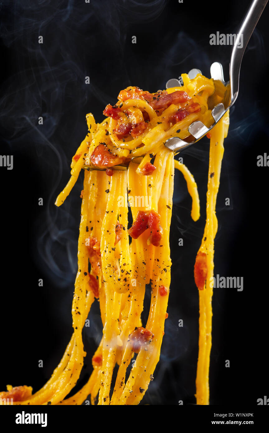 Italian pasta carbonara. On dark background Stock Photo - Alamy