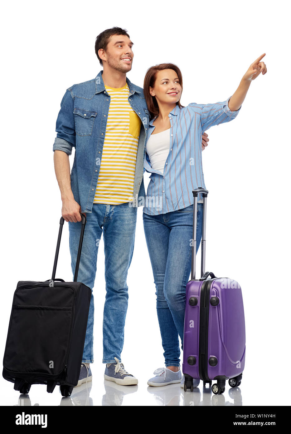 happy couple of tourists with travel bags Stock Photo - Alamy