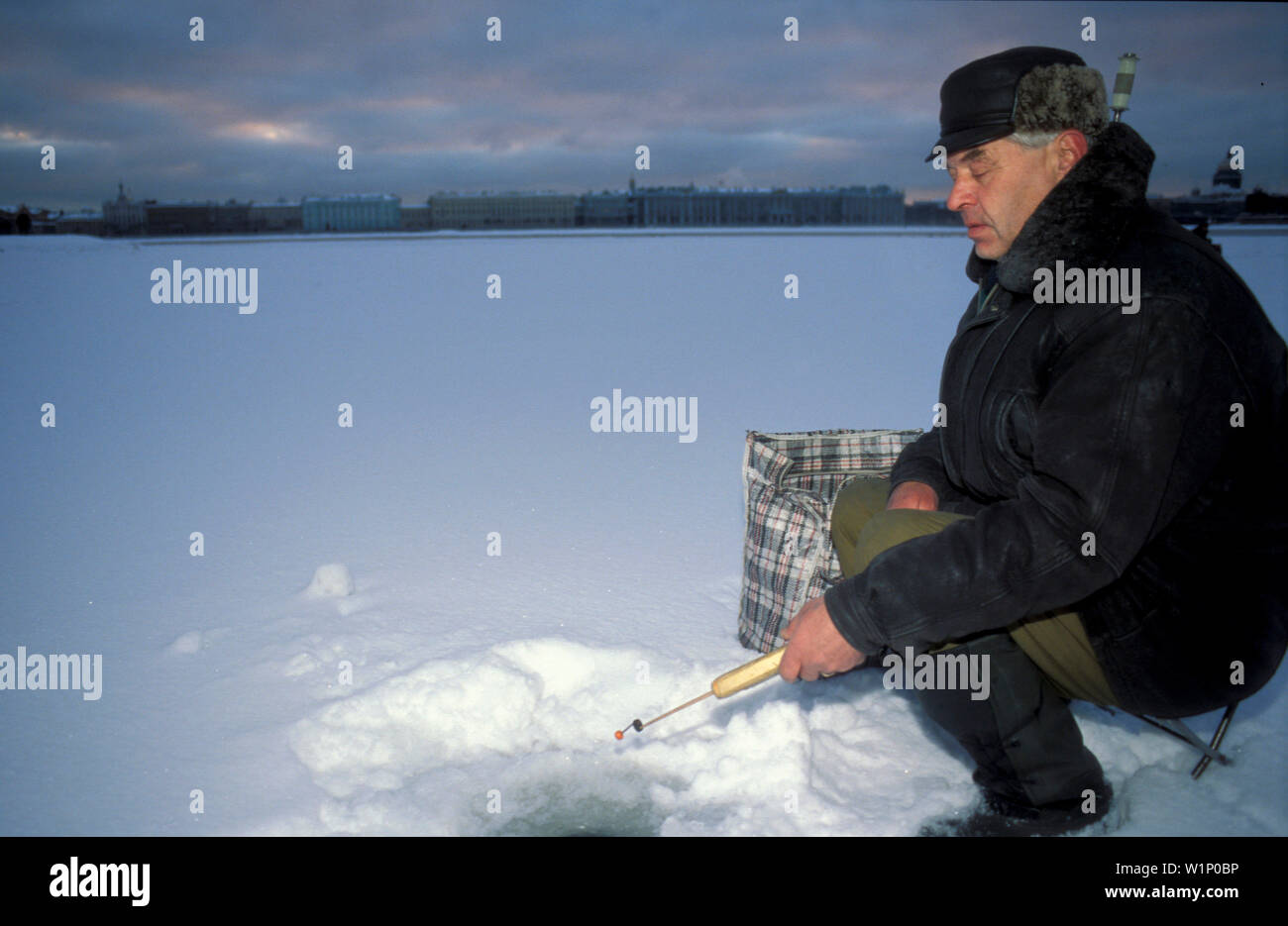 Fishing on the frozen neva river hi-res stock photography and images ...