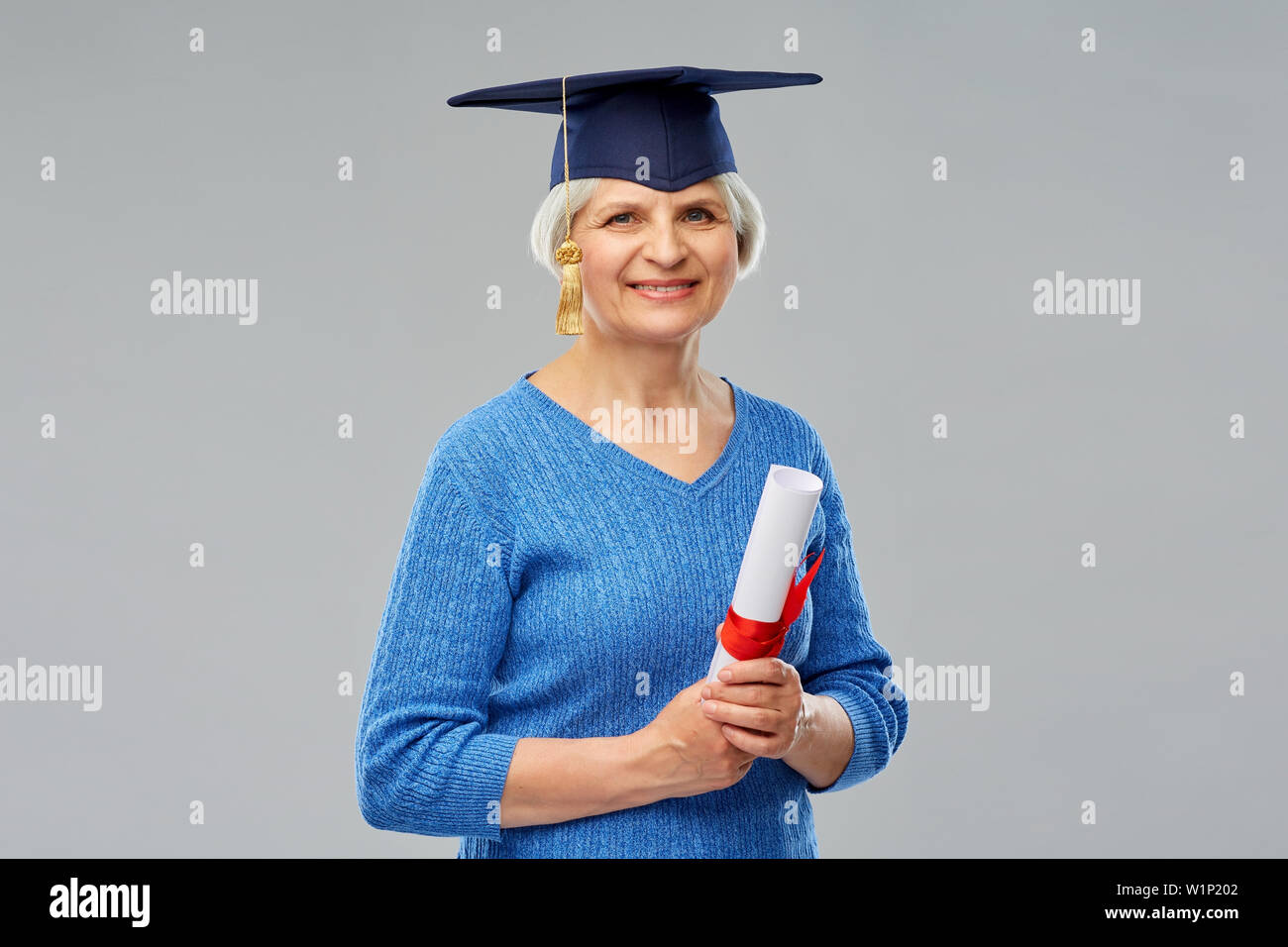 happy senior graduate student woman with diploma Stock Photo - Alamy