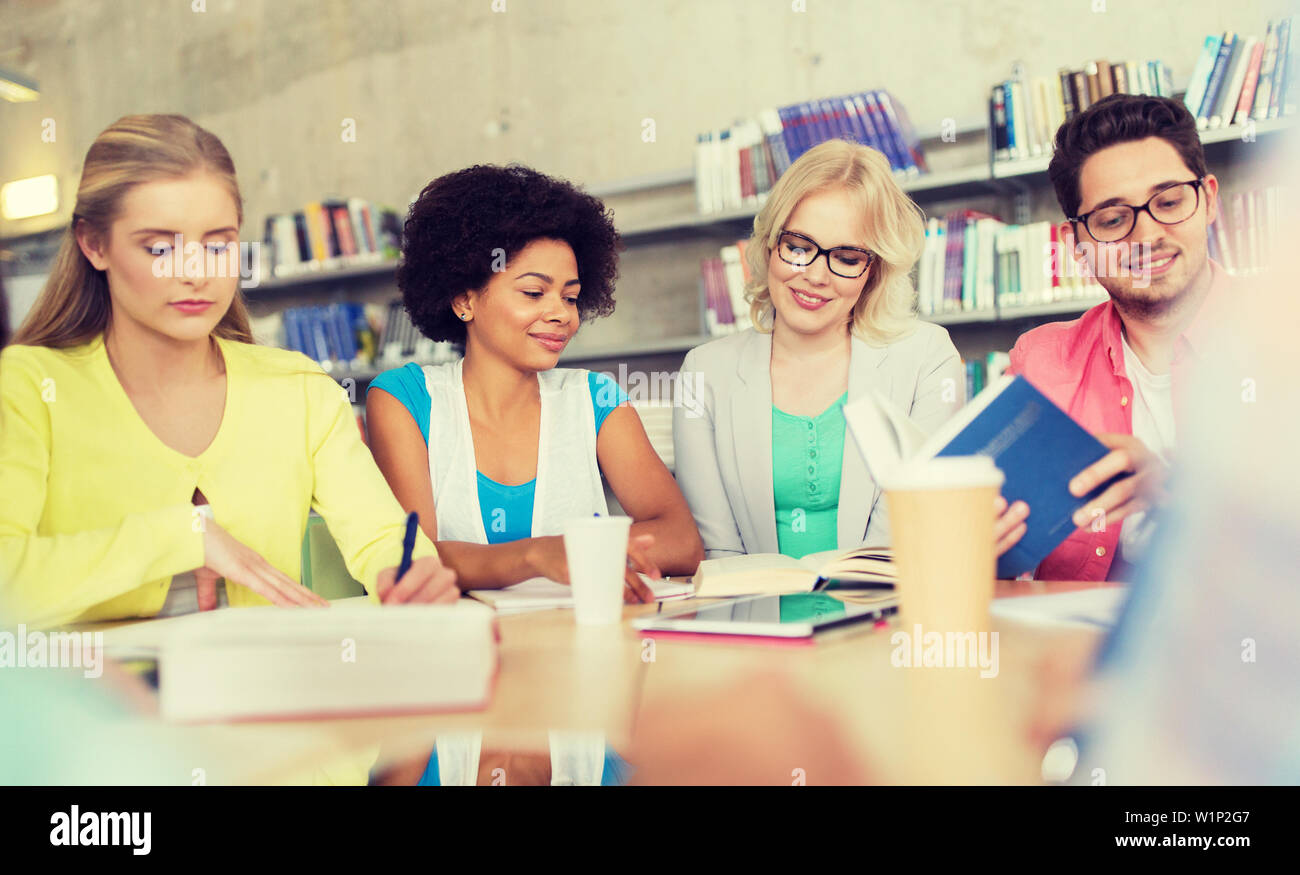 group of students with books at school library Stock Photo - Alamy