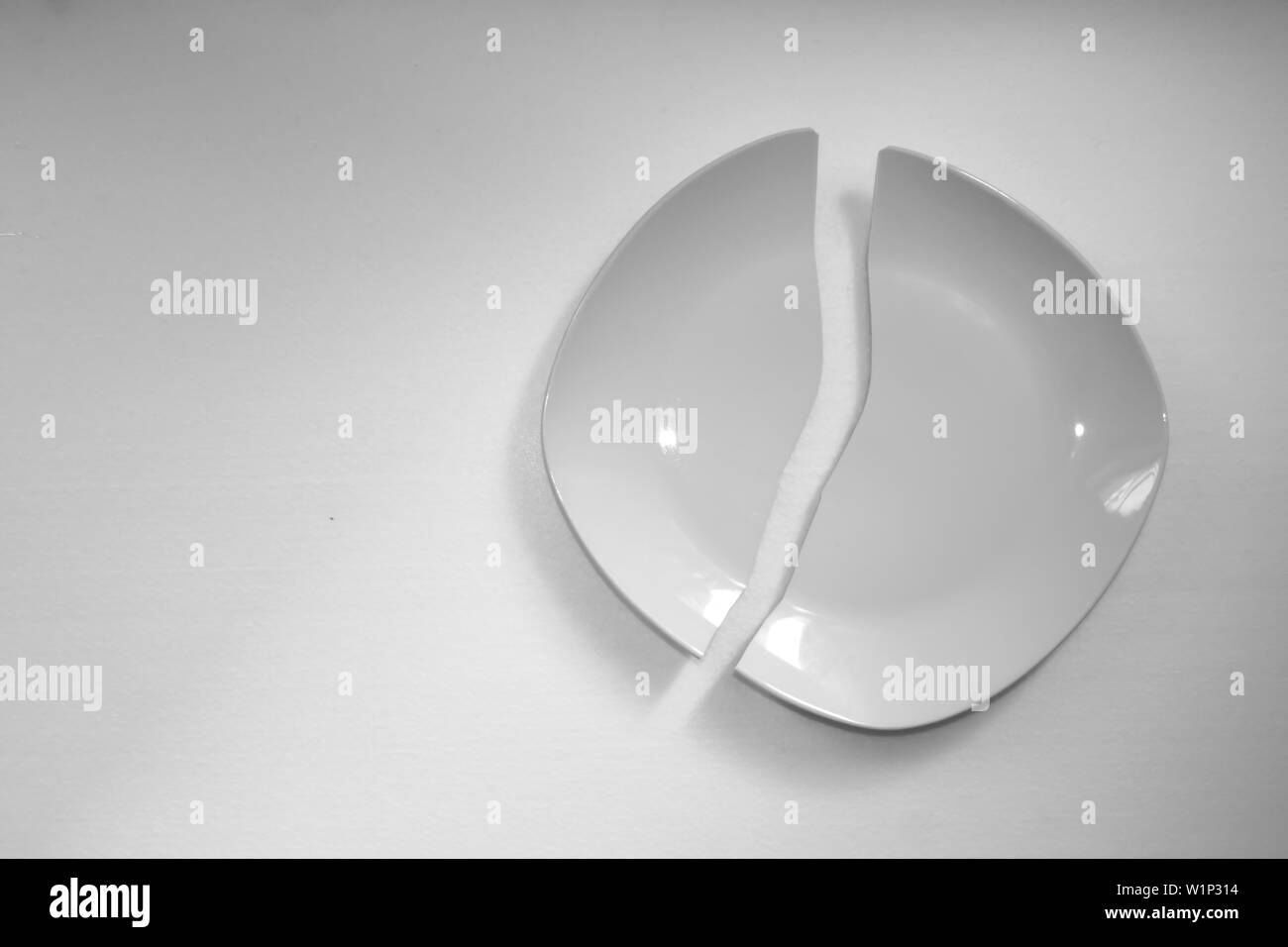 Cracked dish on the white background Stock Photo - Alamy