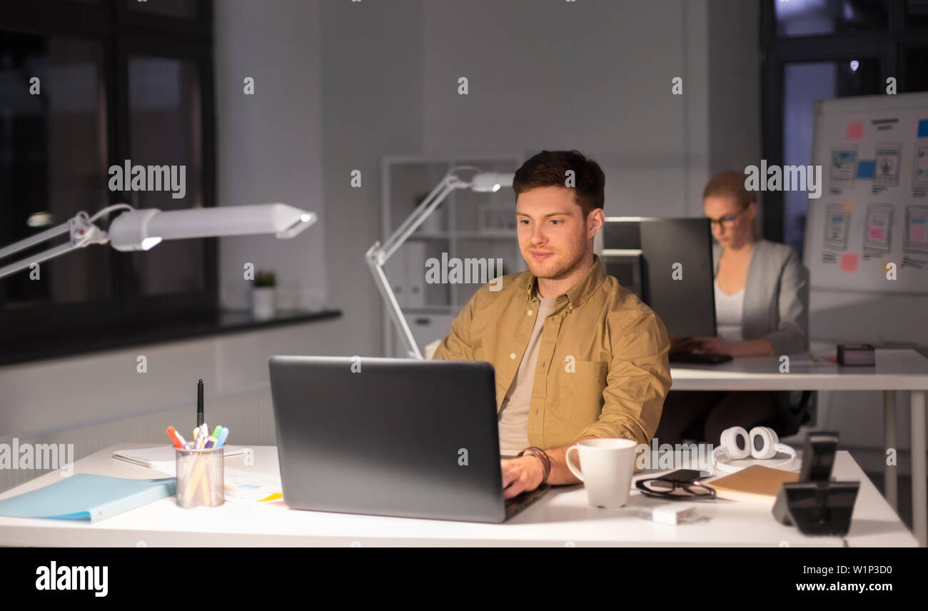 man with computer working late at night office Stock Photo - Alamy