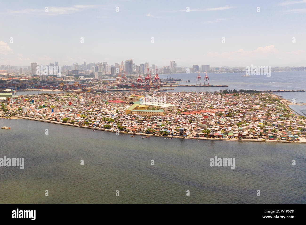 Port in Manila, Philippines. Sea port with cargo cranes. Cityscape with ...