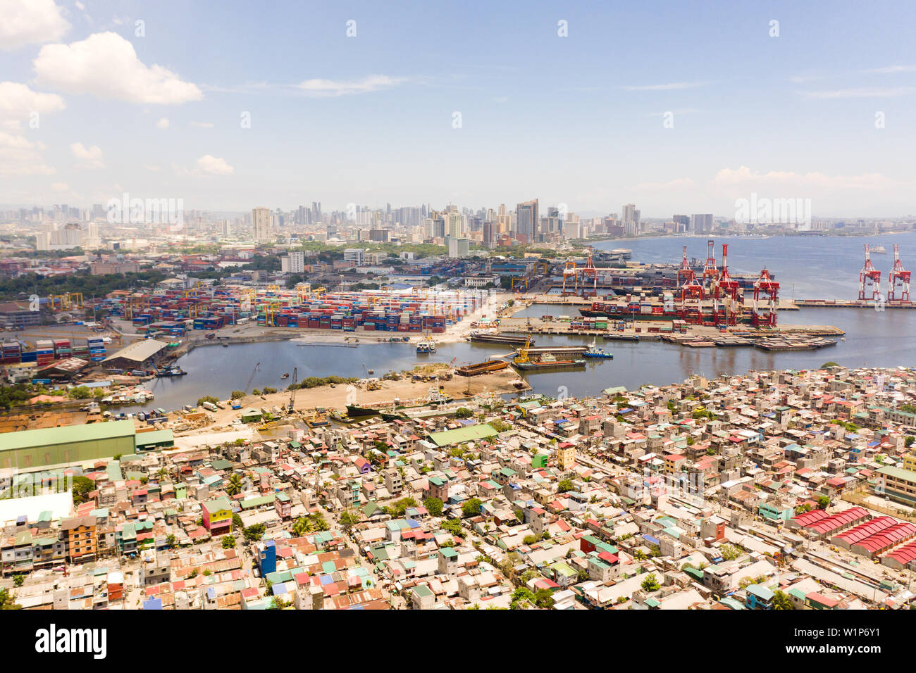 Port in Manila, Philippines. Sea port with cargo cranes. Cityscape with ...