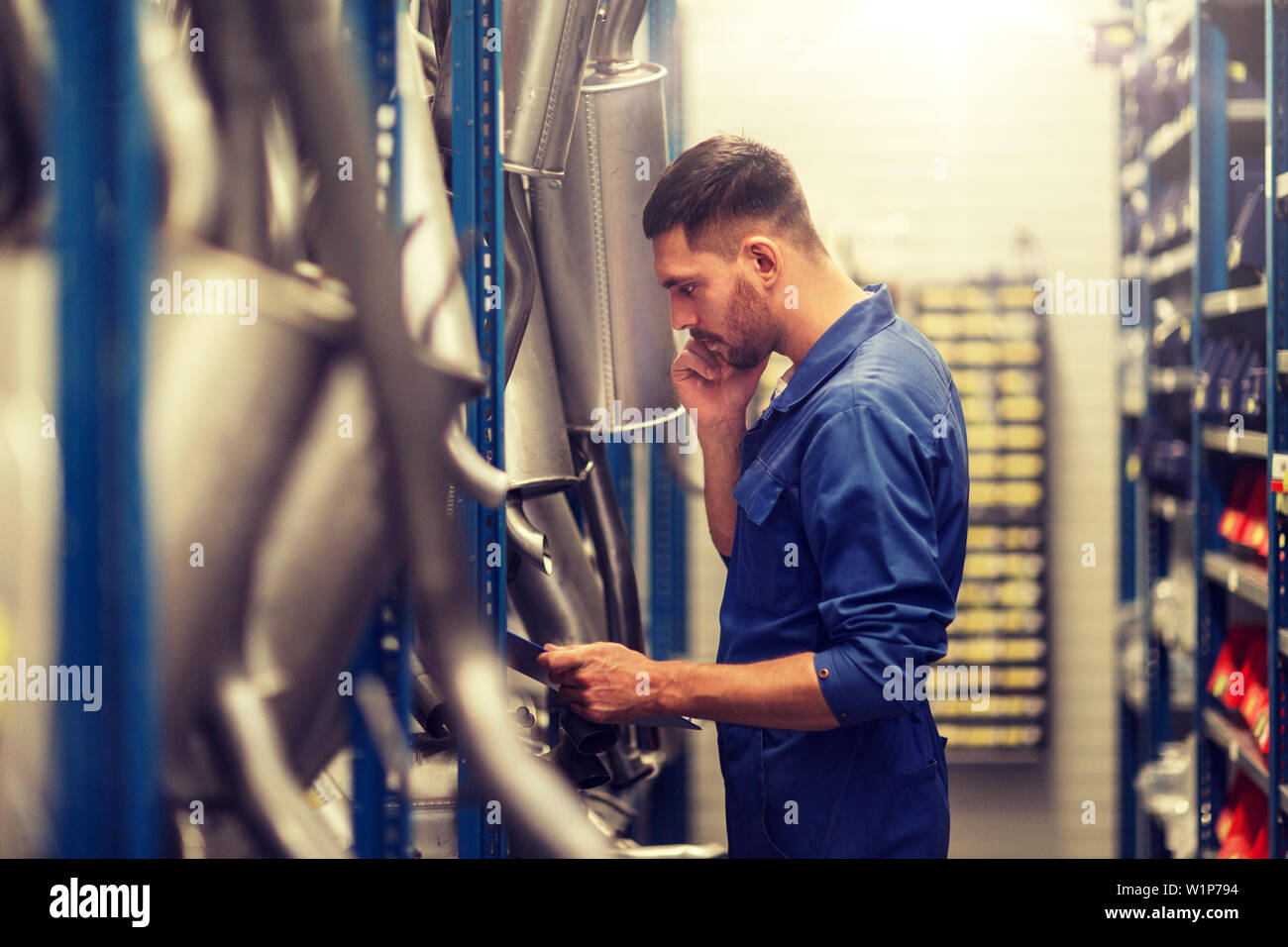 auto mechanic with clipboard at car workshop Stock Photo - Alamy