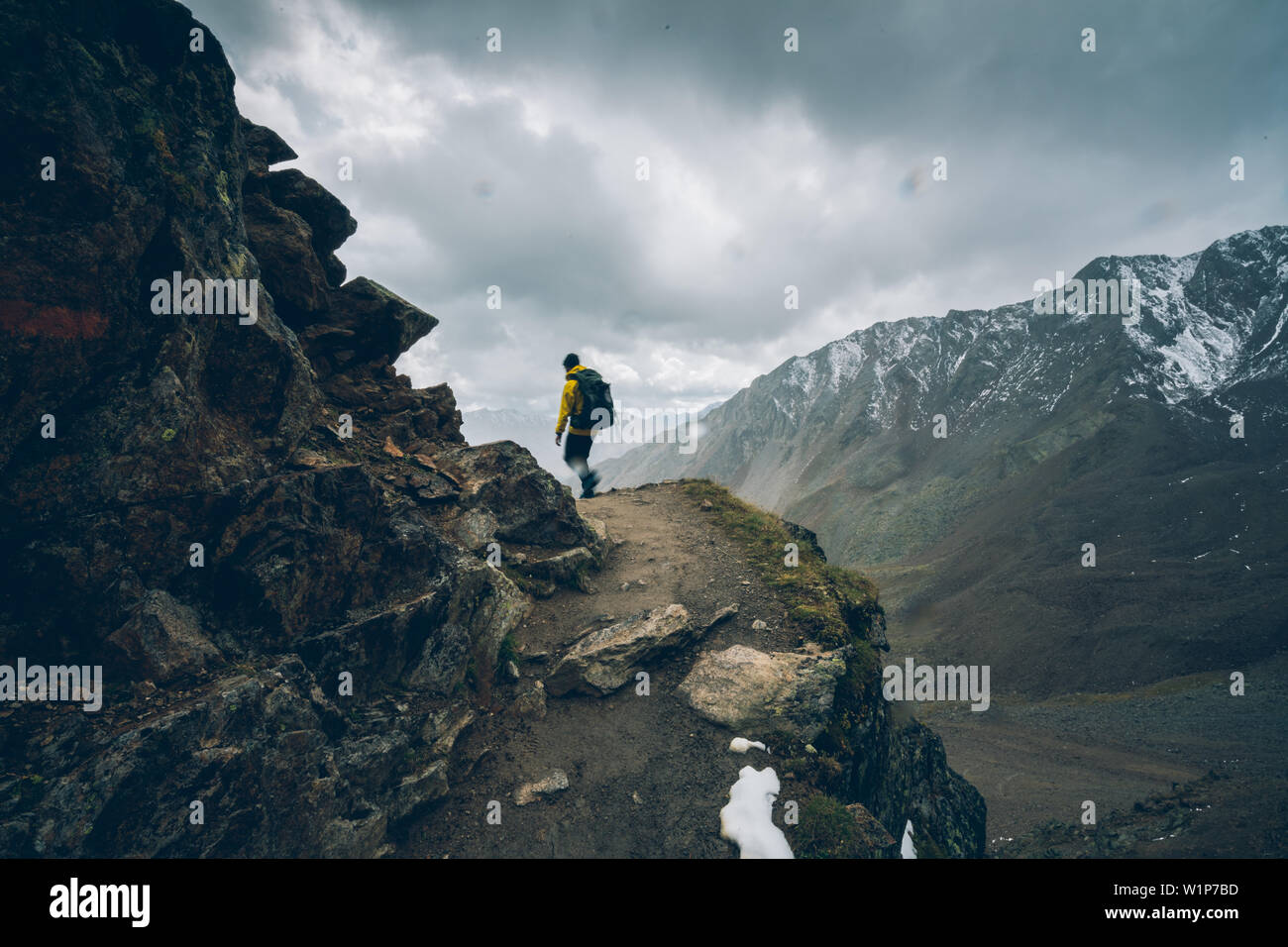 Climber climbing in bad weather, E5, Alpenüberquerung, 6th stage, Vent ...