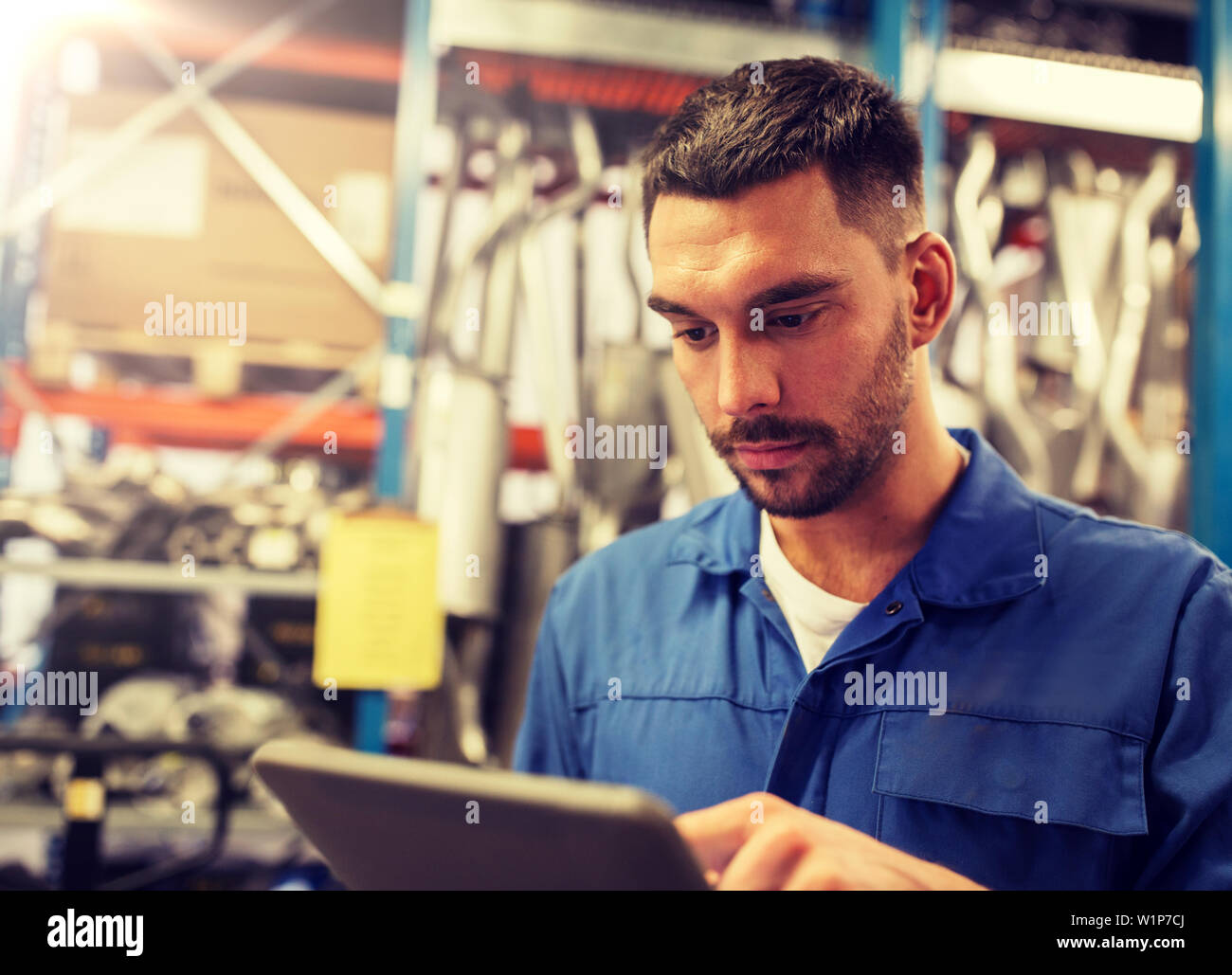 auto mechanic or smith with tablet pc at workshop Stock Photo - Alamy