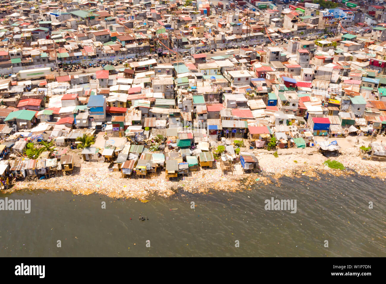 Slums in Manila, a top view. Sea pollution by household waste. Plastic ...