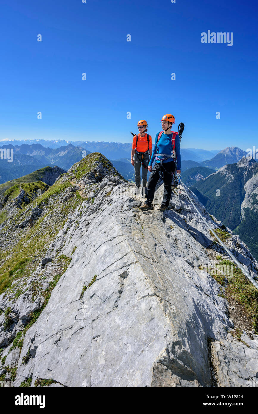 Two women climbing on fixed-rope route Mittenwalder Hoehenweg, fixed ...
