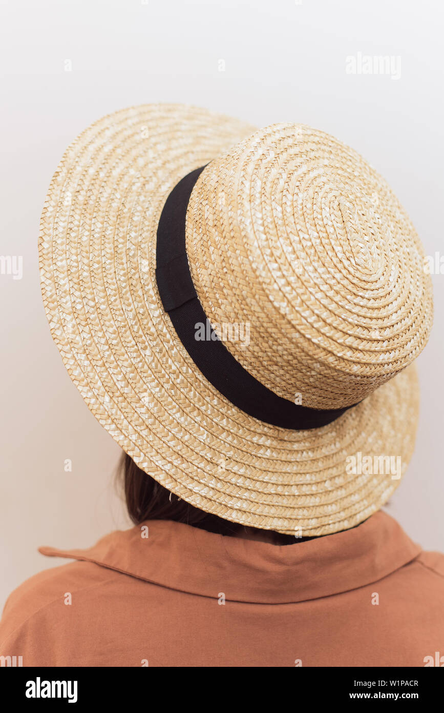 straw hat on a girl, rear view. modern and trendy headdress Stock Photo ...