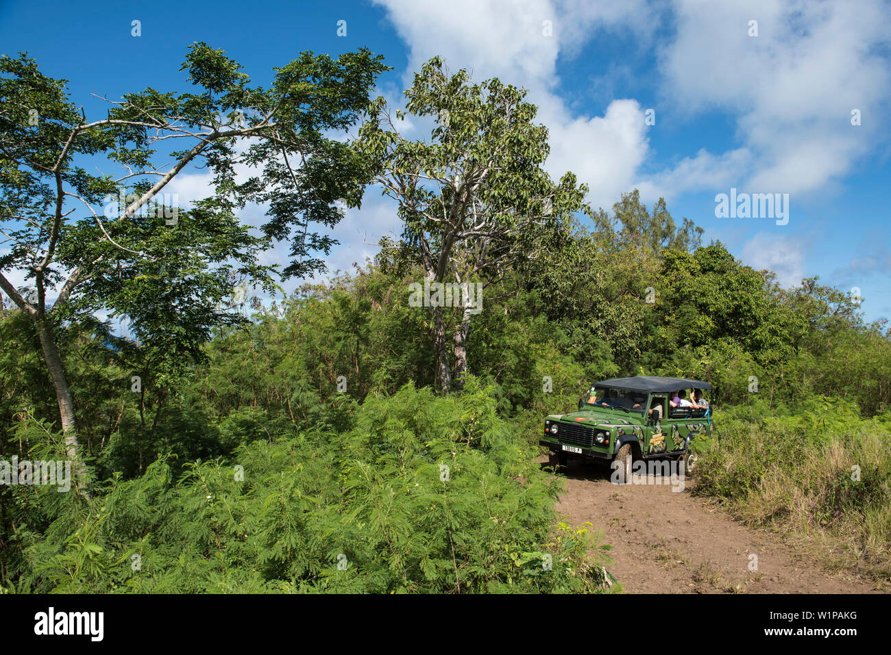 A four-wheel-drive, all-terrain vehicle navigates rough roads through ...