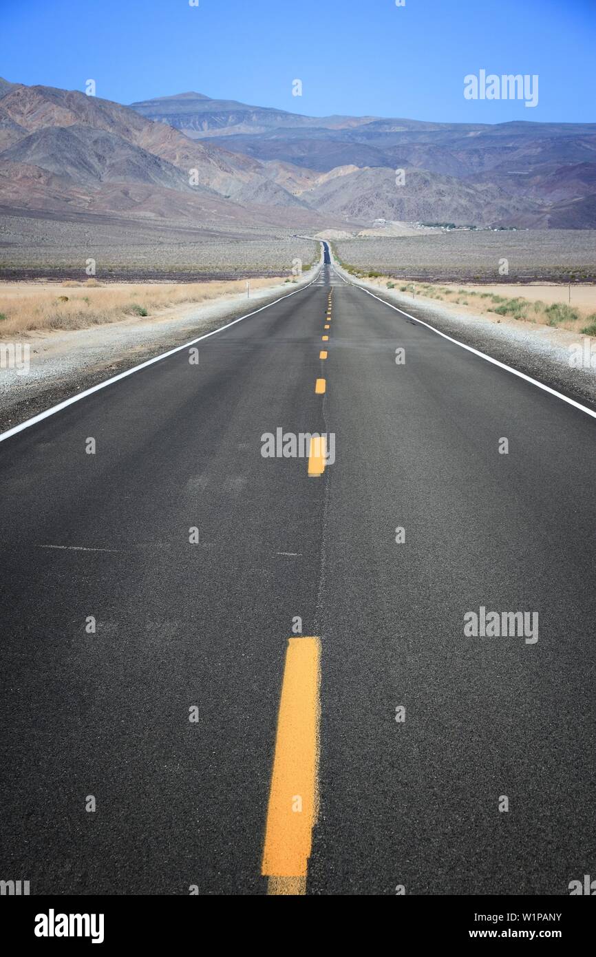 Death Valley road - empty route in Mojave Desert, California Stock ...
