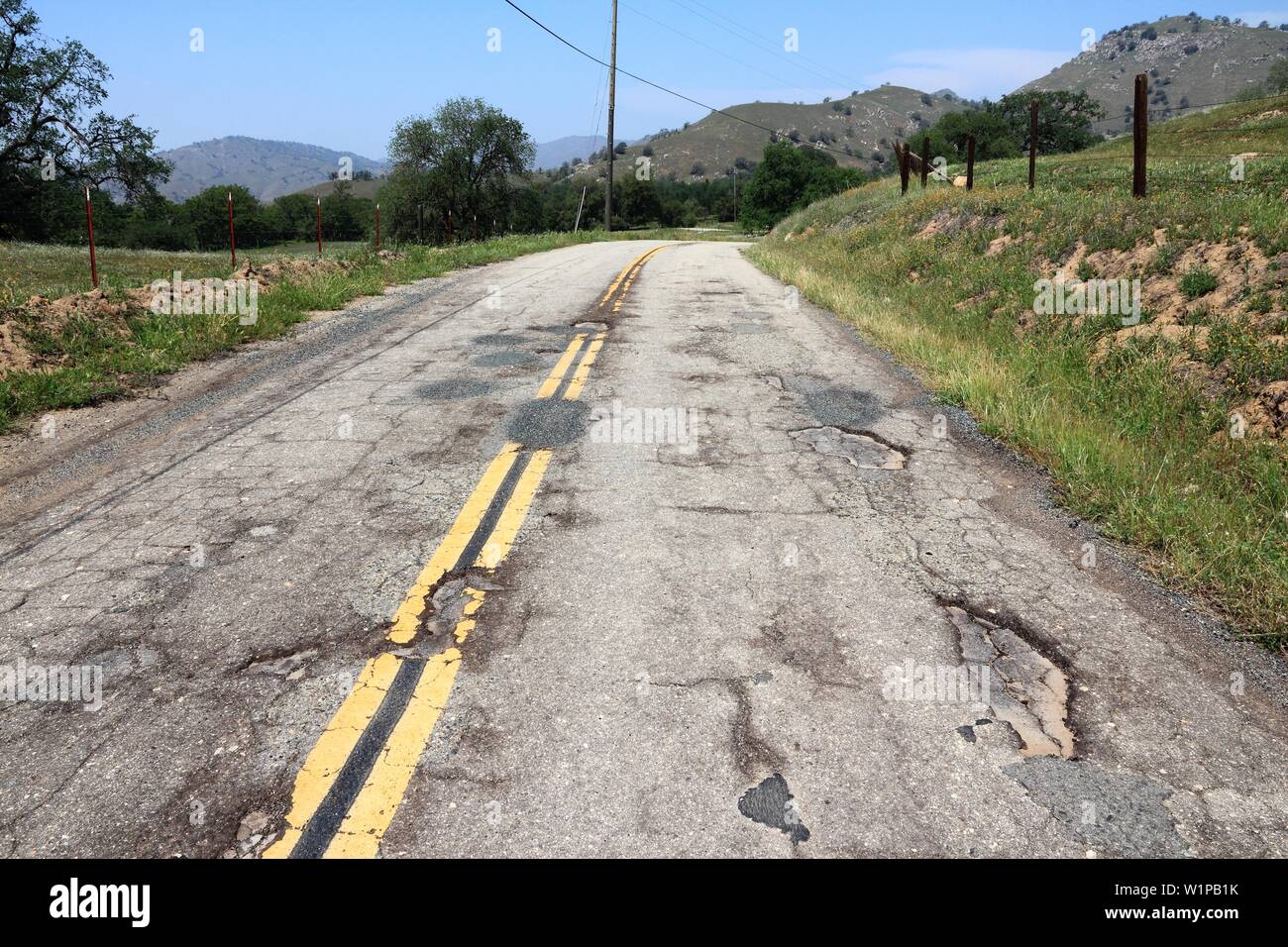 Bad quality road - damaged transportation infrastructure in California ...