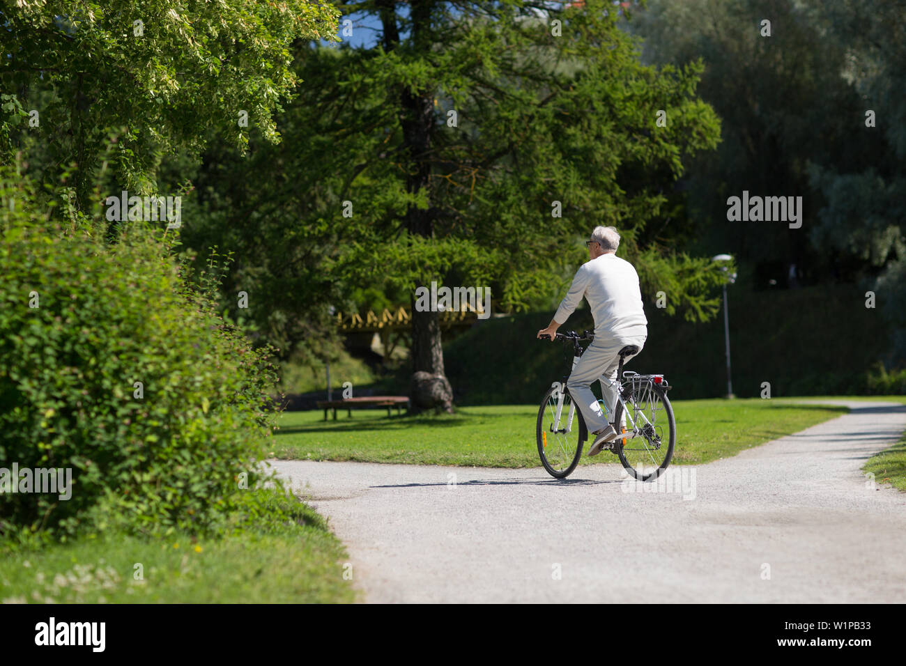 Old man riding bicycle hi-res stock photography and images - Alamy