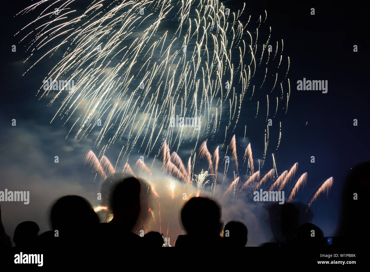 Crowd watching fireworks and celebrating city founded. Beautiful ...
