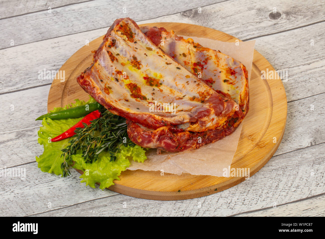 Marinated Raw pork ribs for grill Stock Photo - Alamy