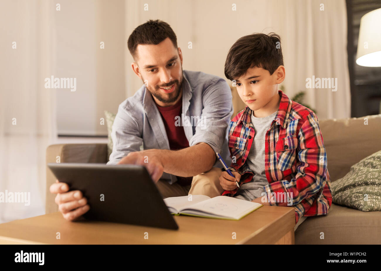 father and son doing homework together Stock Photo - Alamy
