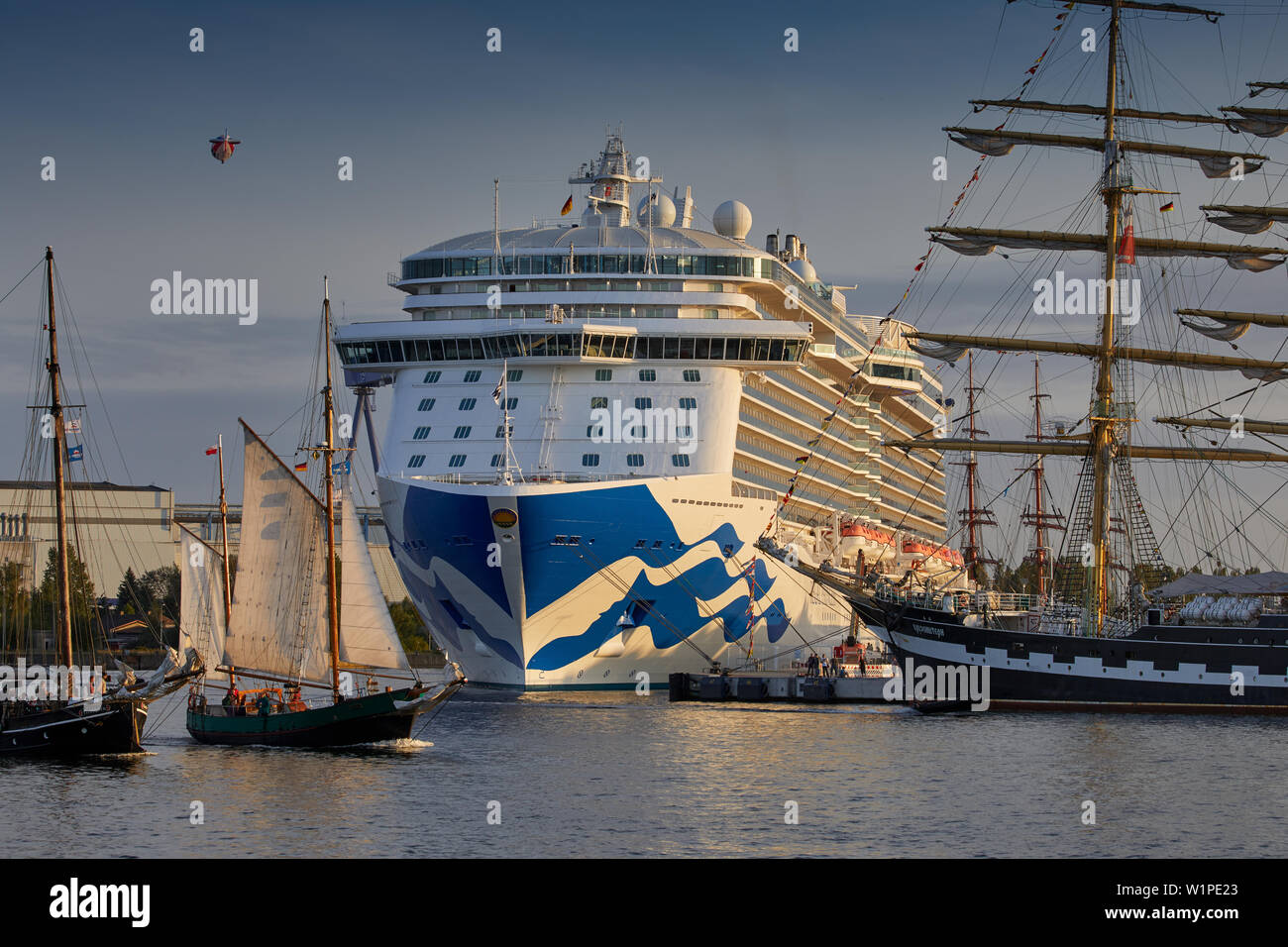 Cruise ship and traditional sailing ship at the Hanse Sail Rostock ...