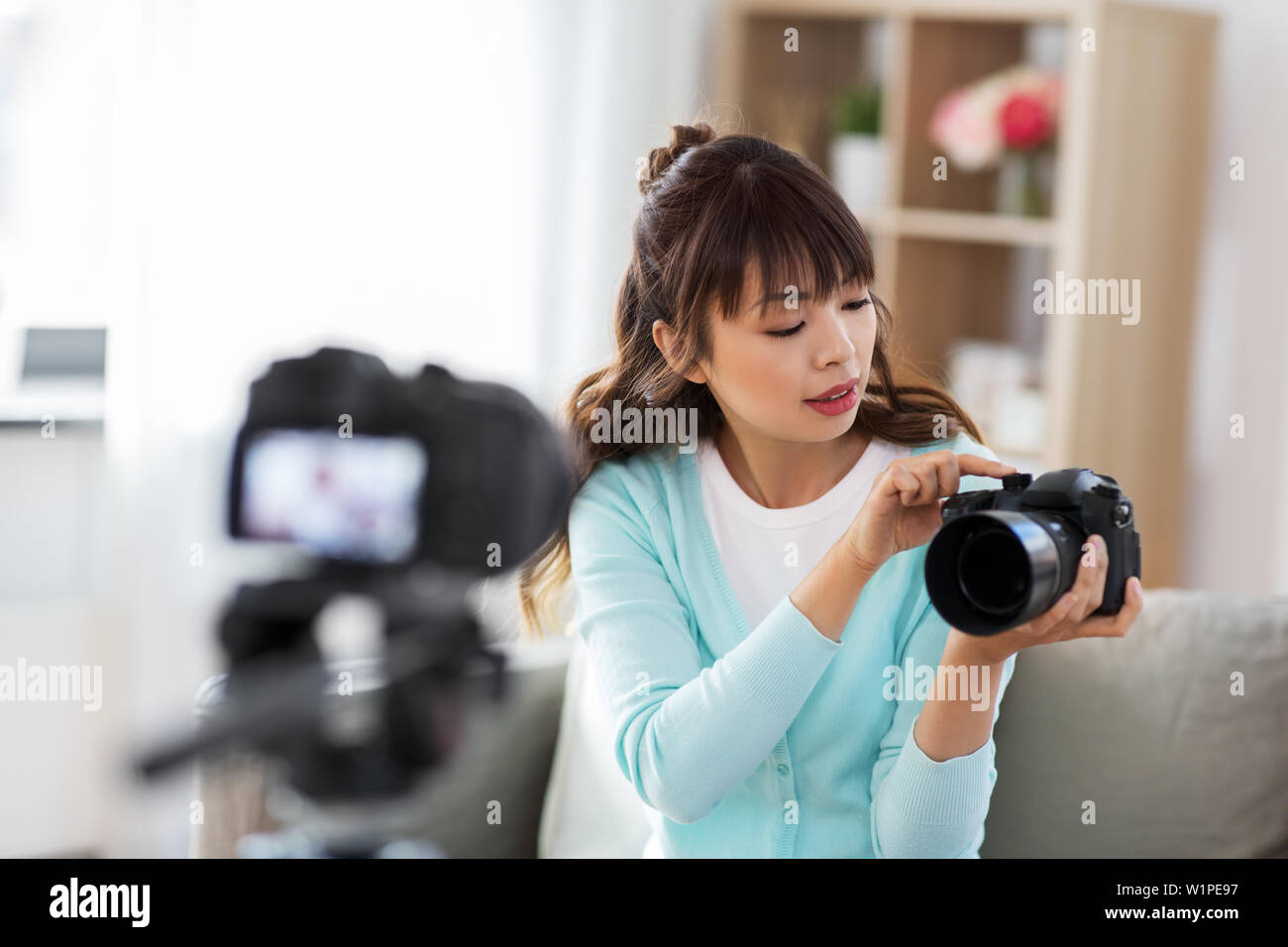 asian female blogger with camera recording video Stock Photo - Alamy