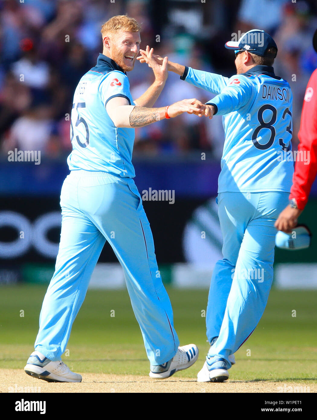 England's Ben Stokes (left) celebrates bowling out New Zealand's Colin ...