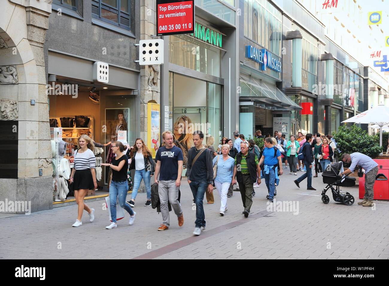 HAMBURG, GERMANY - AUGUST 28, 2014: People visit fashion shops in ...