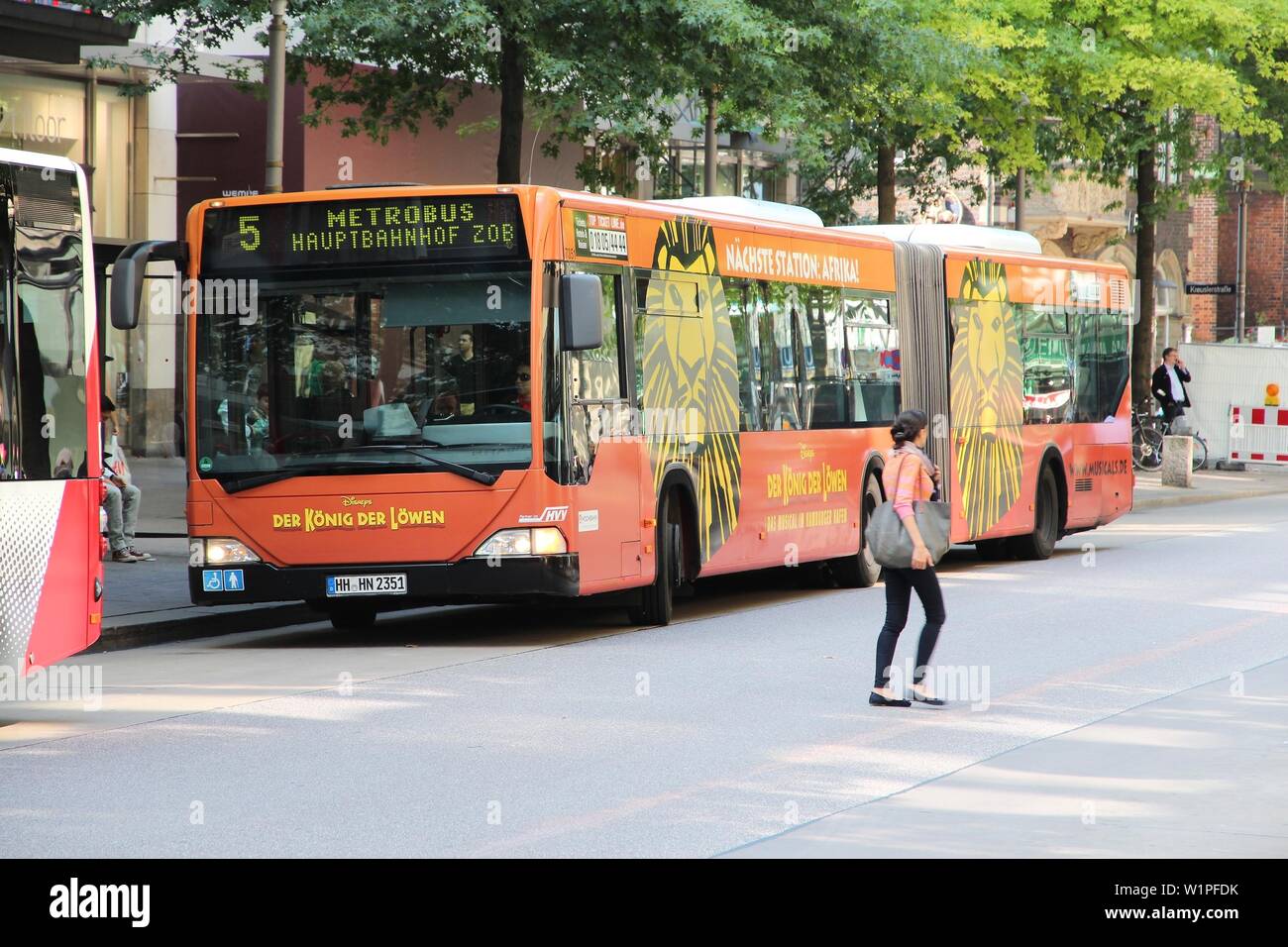 HAMBURG, GERMANY - AUGUST 28, 2014: People ride city bus in Hamburg ...
